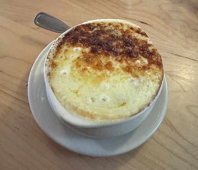 French Onion Soup with that golden, bubbling crown of cheese – comfort food that's dressed for a fancy night out.