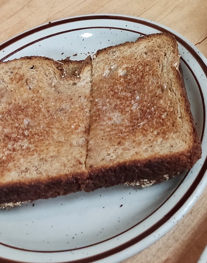 Toast so perfectly golden it belongs in Fort Knox. This isn't just bread that met heat—it's a transformation worthy of a breakfast fairy tale.