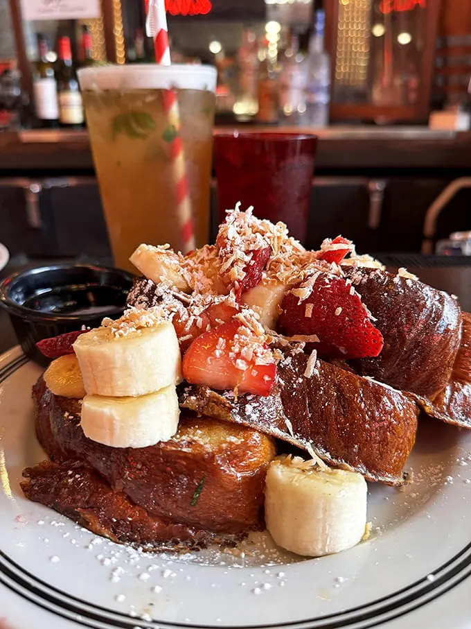 French toast that's dressed for success with fresh fruit, powdered sugar, and enough decadence to make breakfast feel like getting away with something.