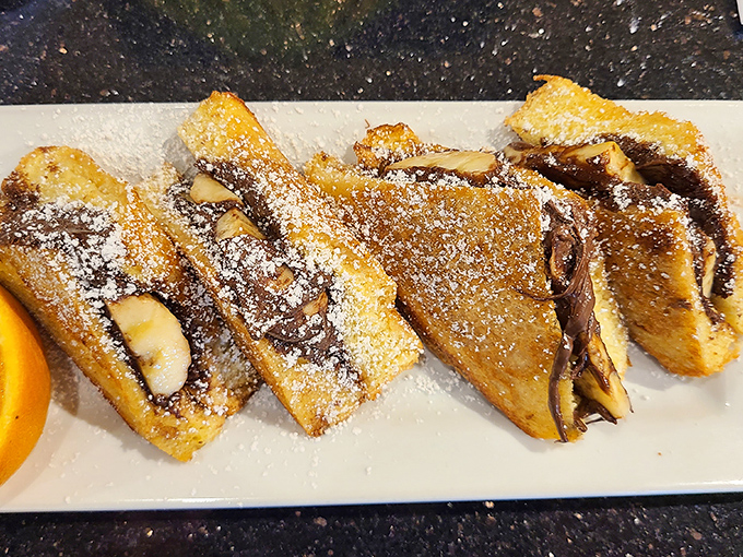 French toast stuffed with what appears to be Nutella and bananas—proof that breakfast can double as therapy. No appointment necessary.