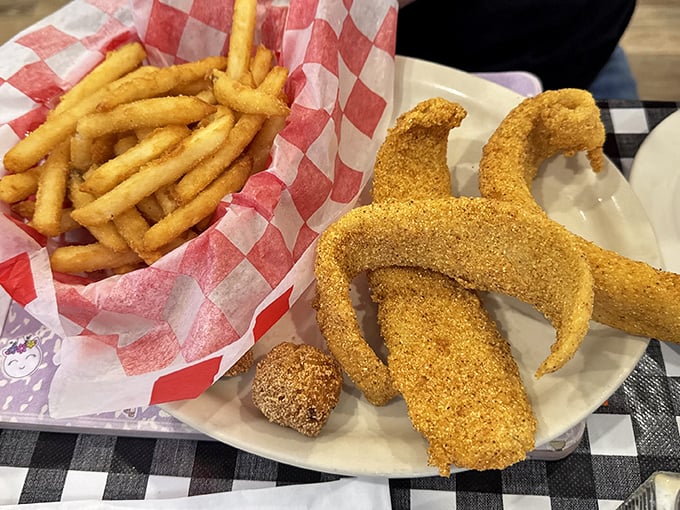 Golden-fried catfish and crispy fries—the kind of simple perfection that makes you wonder why you ever bother with fancy restaurants.