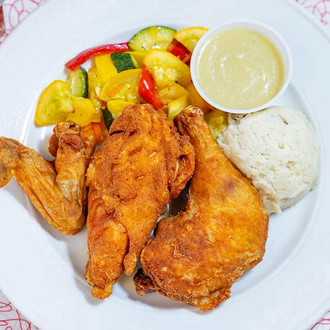 Golden-fried chicken that makes you want to write poetry. Paired with vegetables that somehow make you feel virtuous while committing delicious sins.
