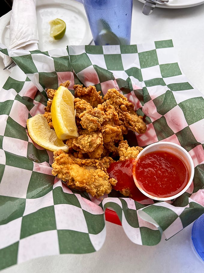 Crispy, golden-fried oysters served with a wedge of lemon and dipping sauce. These little flavor bombs are the ocean's perfect bite-sized gift.