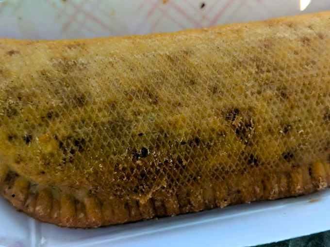 This isn't just a fried pie—it's a golden-brown time machine to your grandmother's kitchen, crispy on the outside, molten fruit heaven inside.