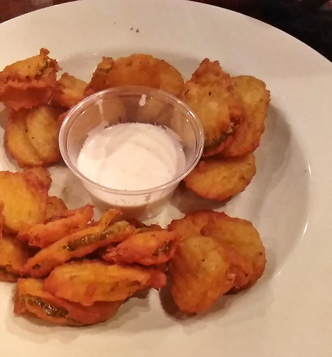 Fried pickles – where tangy meets crispy in a Southern handshake. That dipping sauce isn't optional, it's mandatory deliciousness.
