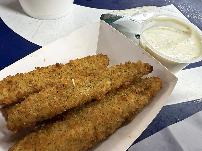 Fried pickle spears—the unsung heroes of the side dish world. Crispy, tangy, and paired with a dip that makes you wonder why you'd eat pickles any other way.