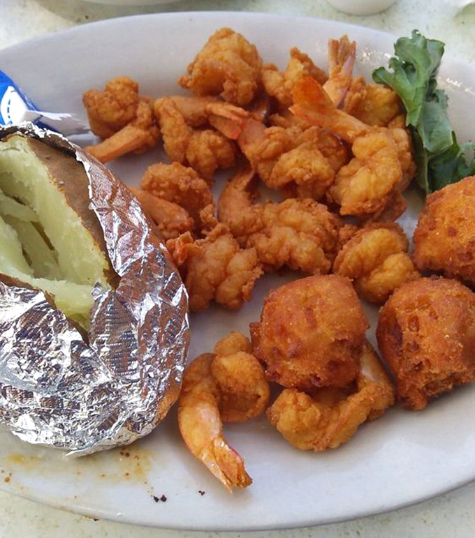 Golden-fried shrimp and hushpuppies—proof that sometimes the simplest pleasures require nothing more than hot oil and impeccable timing.