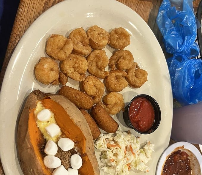 Golden fried shrimp that crunch like tiny treasures from Neptune's personal cookbook – absolutely addictive.