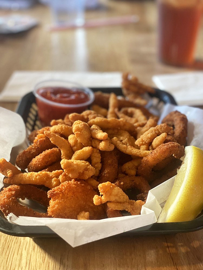 Crispy treasures from Neptune's pantry. These golden-fried clams and calamari are what seafood dreams are made of—just add that tangy dipping sauce!