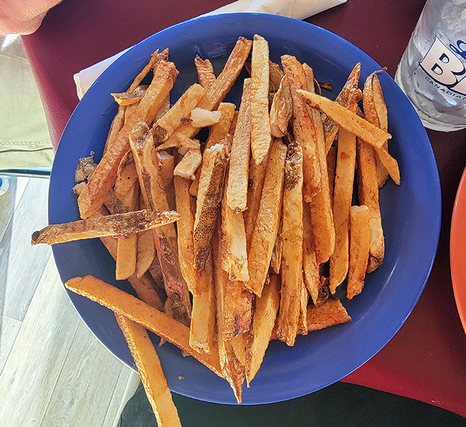 The stars of the show – hand-cut fries with that perfect crispy-outside, fluffy-inside magic that keeps Ohio drivers filling their gas tanks for return trips.