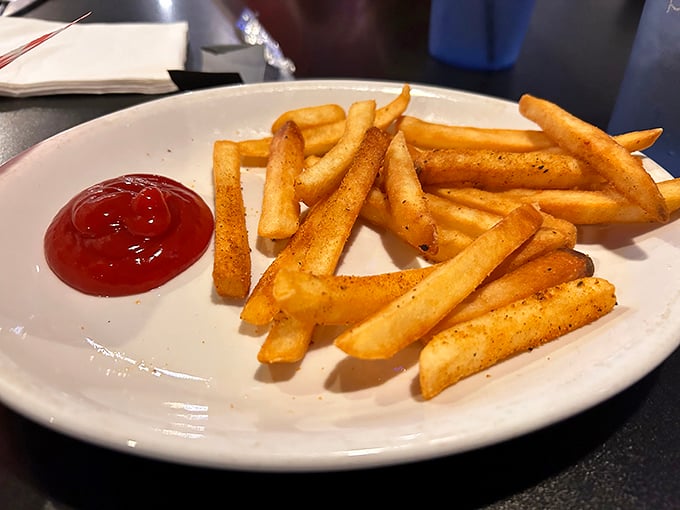 Golden, crispy, seasoned fries that deserve their own spotlight. These aren't mere side dishes—they're supporting actors stealing scenes from the main attraction.