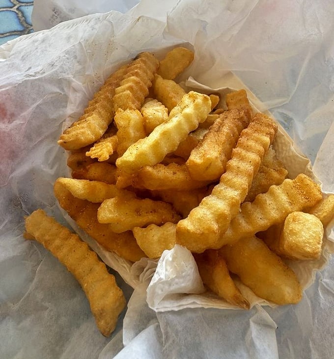 These aren't just fries – they're strategic heat-management tools disguised as a side dish. Crispy, seasoned, and essential for your hot chicken adventure.