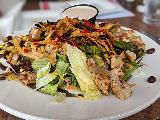 A salad that defies the "rabbit food" stereotype – loaded with grilled chicken, crispy tortilla strips, and enough fresh vegetables to silence your doctor temporarily.