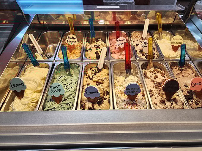 The gelato case – where difficult decisions are made and diet resolutions go to die in colorful, creamy glory.