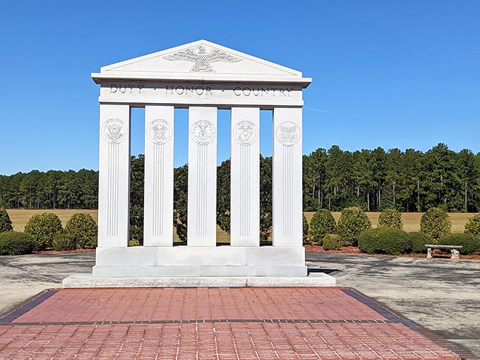 Duty, Honor, Country etched in marble at Georgia Veterans Memorial—a solemn reminder of sacrifice amid the peaceful Georgia pines.