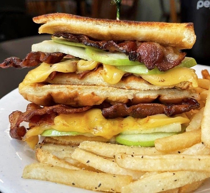 This isn't just a sandwich—it's architecture. Layers of melted cheese and perfectly toasted bread with home fries that refuse to be sidekicks.