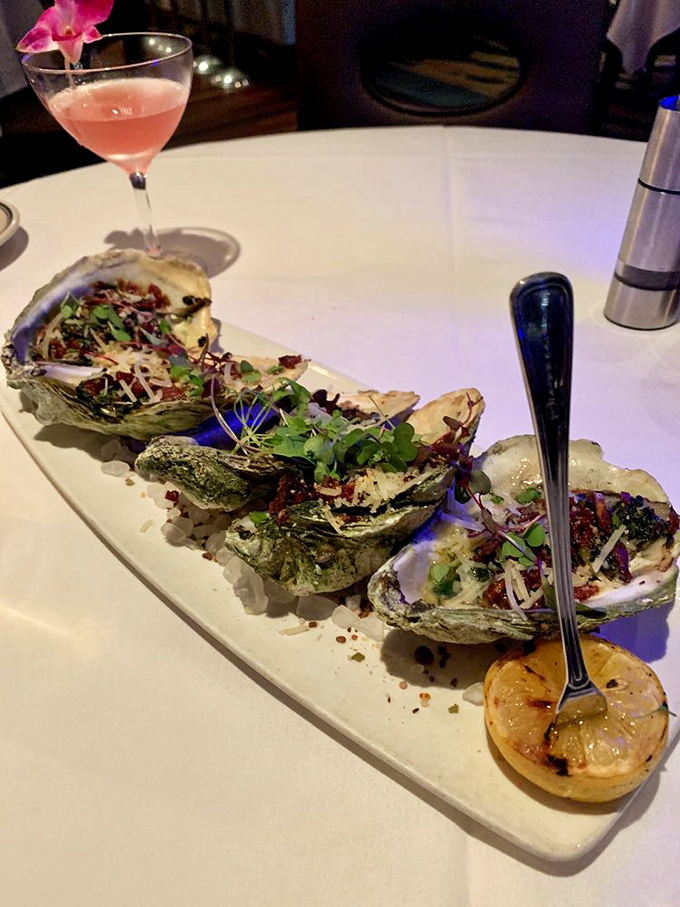 These grilled oysters aren't just seafood—they're little ocean jewels, dressed up with savory toppings and ready for their close-up.