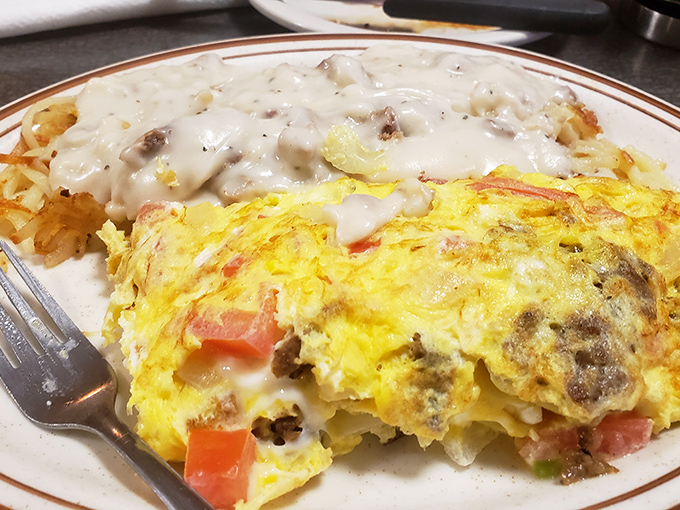 When breakfast can't decide what it wants to be, you get this glorious mashup—an omelet with hash browns smothered in country gravy.