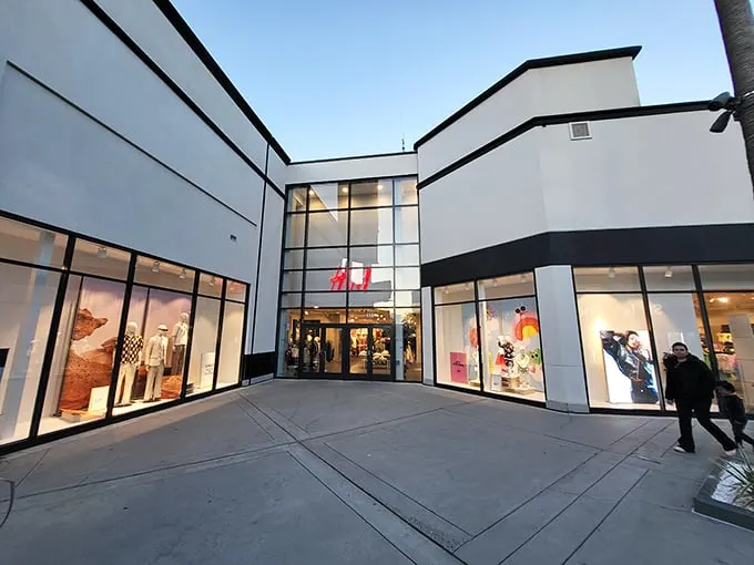 H&M's minimalist façade belies the fashion treasure trove within—where "just browsing" becomes "somehow I bought seven items I didn't know I needed."