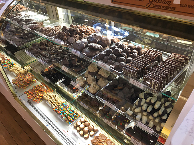 The chocolate display case—where willpower goes to die and diet plans are forgotten faster than New Year's resolutions.