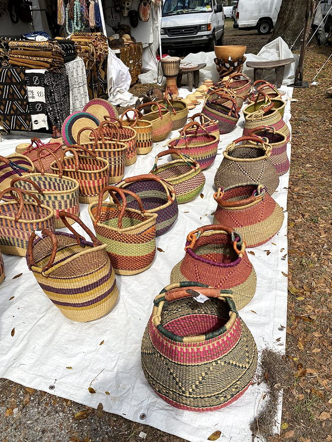 Handwoven baskets in a rainbow of earthy hues—practical art that's traveled from skilled hands to blanket-covered display.