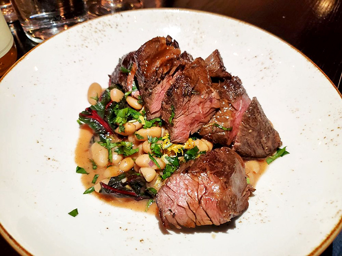 Hanger steak cooked to that perfect ruby interior that meat aficionados dream about, with beans that aren't just along for the ride.