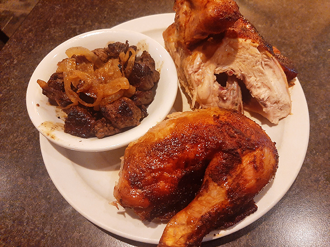 The honey-glazed chicken arrives like a caramelized work of art, accompanied by sirloin tips that could make even dedicated beef lovers consider poultry as a worthy alternative.
