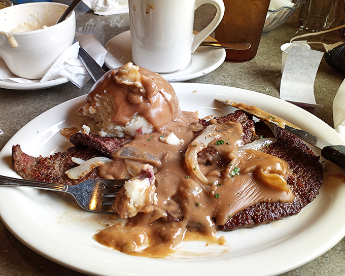 Hot roast beef that doesn't just melt in your mouth—it practically signs a lease. That gravy deserves its own fan club.