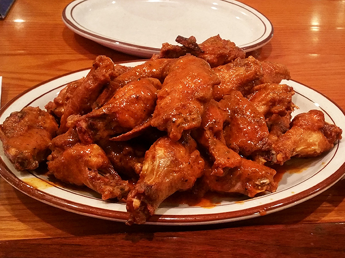 These wings aren't just coated in sauce—they're baptized in it. The kind of messy, delicious experience that makes you grateful for extra napkins.