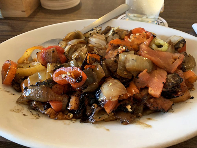 The legendary Hot Pepper Salad in all its glory. These grilled peppers, onions, and tomatoes perform a flavor symphony that's worth every mile of your journey. 