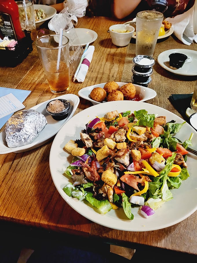 This isn't just any salad – it's a colorful Florida canvas with fresh greens, vibrant vegetables, and enough protein to satisfy even the most dedicated carnivore.