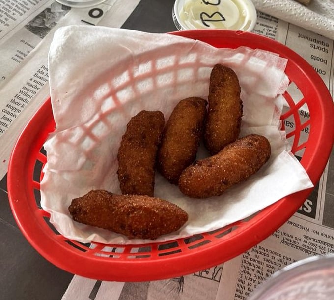 Hush puppies so perfectly golden they could make a Southern grandmother weep with joy—crispy outside, tender inside, and utterly irresistible.