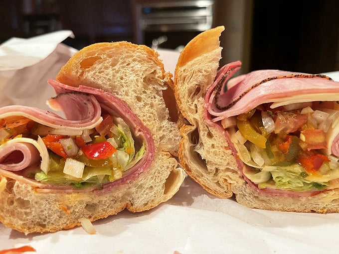 The Italian sub, where vegetables are merely guests at a meat party. Those layers of ham could tell stories that would make your grandmother blush.