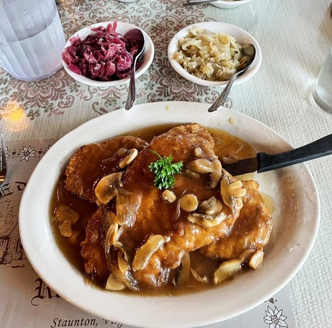 The Jägerschnitzel arrives swimming in mushroom gravy like it's training for the Olympics. That red cabbage adds the perfect sweet-tart counterpoint to the richness.