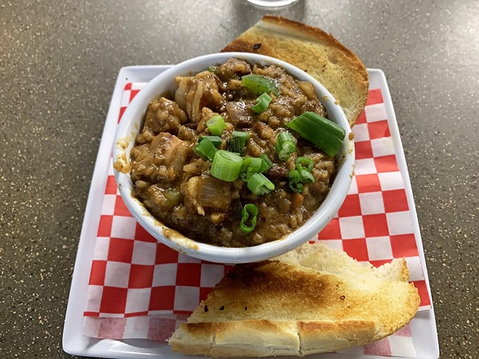 Jambalaya that looks like it could start a family feud over who gets the last spoonful. Those green onions aren't just garnish—they're the exclamation points on a Cajun masterpiece.