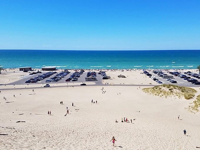 Beach real estate at a premium! The summer crowd spreads across the sand like a friendly invasion, each family claiming their temporary kingdom.