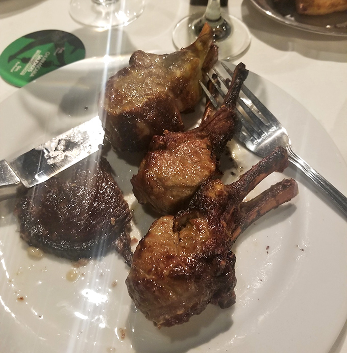 These lamb chops aren't just dinner—they're tiny meat lollipops for grown-ups, glistening with promise and begging for your attention.