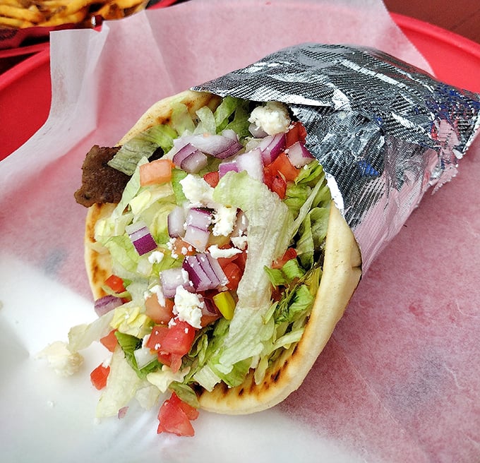 This gyro isn't just wrapped in foil—it's wrapped in flavor. Fresh veggies and feta provide the perfect cool counterpoint to seasoned lamb.