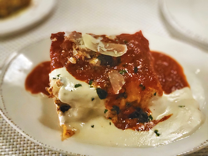 Layers of pasta, cheese, and sauce in perfect harmony—like the Beatles of Italian cuisine if the Beatles were smothered in melted mozzarella.