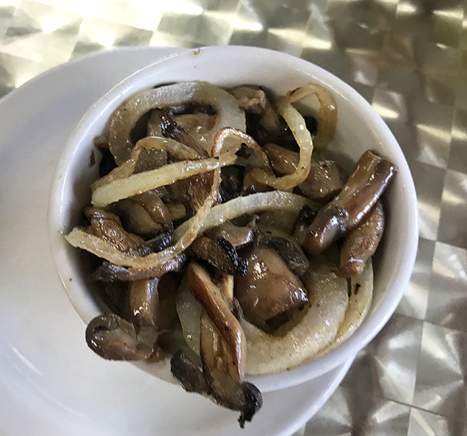 Sautéed mushrooms and onions that have reached that magical caramelized state where vegetables transcend into something almost sinful.