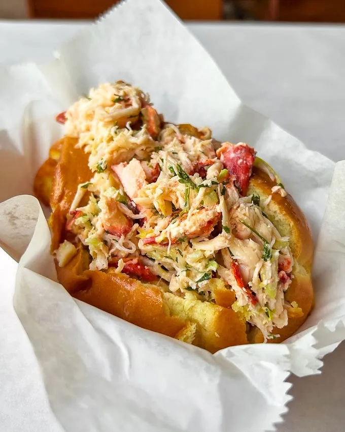 A lobster roll that doesn't skimp on the good stuff—chunks of sweet meat nestled in a buttery vessel. New England, take notes.