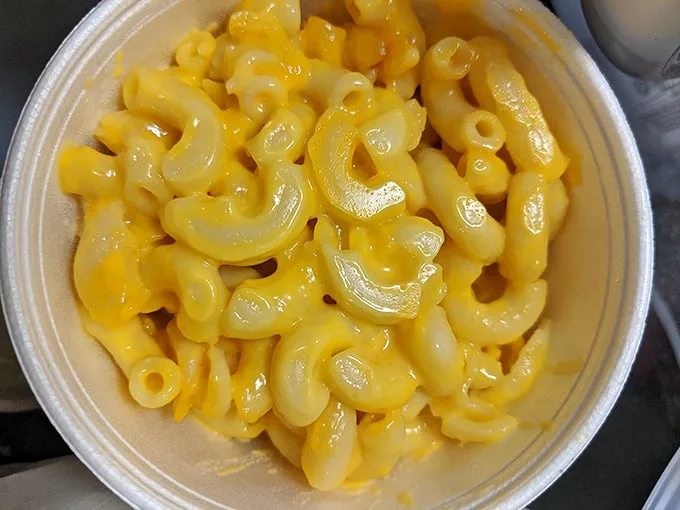 Mac and cheese that glows like South Carolina sunshine—each elbow noodle swimming in a pool of molten gold.