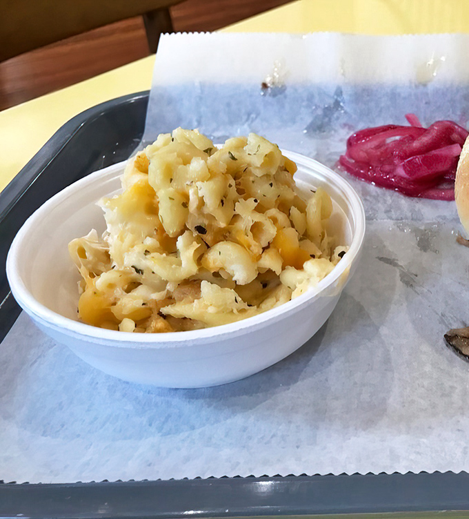 Mac and cheese that actually tastes like real cheese—what a concept! This creamy side isn't playing second fiddle to anyone, not even those magnificent meats.