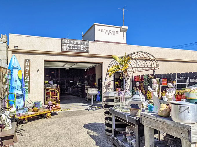 Main Street Antiques beckons treasure hunters with maritime curiosities and coastal collectibles spilling onto the sidewalk. One person's castoff, another's centerpiece!