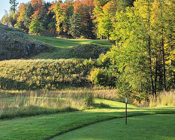 Marquette Golf Club's dramatic landscape turns a simple round into a scenic adventure, with fairways carved between rocky outcroppings and autumn-painted forests.