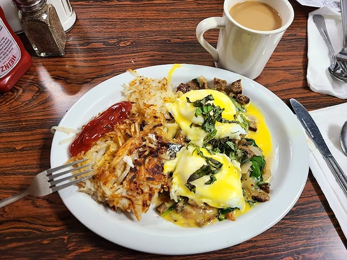 Pancakes so fluffy they could float away, paired with eggs and sausage – the breakfast trifecta that's been solving problems since the dawn of diners.