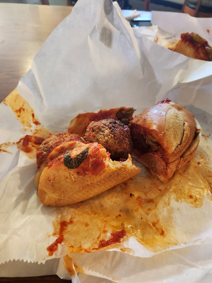 The meatball sandwich that launched a thousand food pilgrimages. Those sauce-soaked spheres of meaty perfection demand to be devoured immediately.