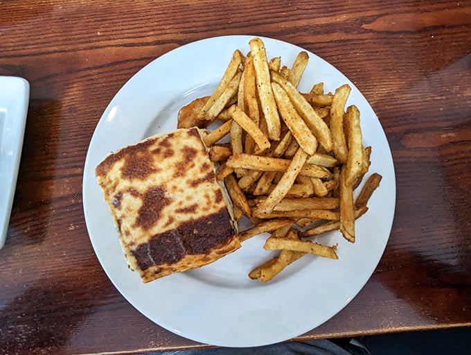 Moussaka meets fries in a match made in culinary heaven. The perfectly browned top hints at the creamy béchamel and savory layers waiting beneath.