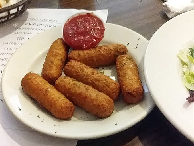 Golden-brown mozzarella sticks: the adult version of string cheese that required formal training. Crispy armor protecting gooey treasure within. 