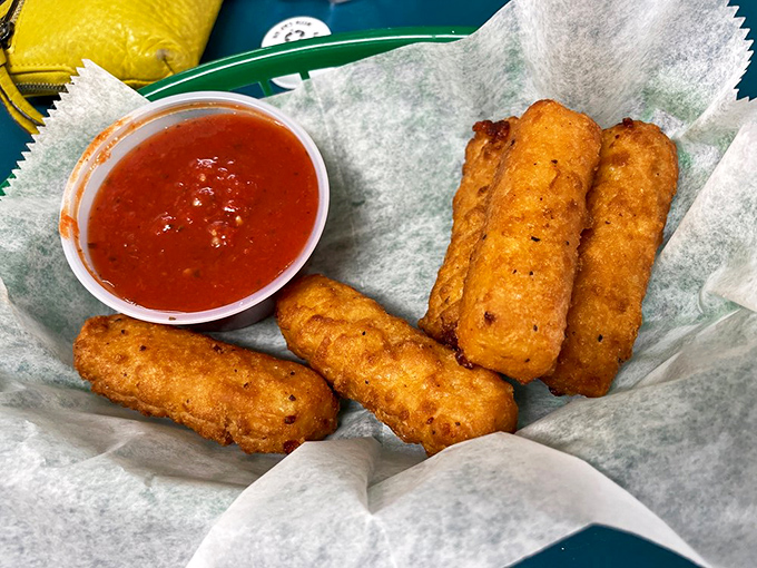 Golden-fried mozzarella sticks—the appetizer equivalent of a warm hug, where the cheese pull is measured in feet rather than inches. Marinara mandatory.